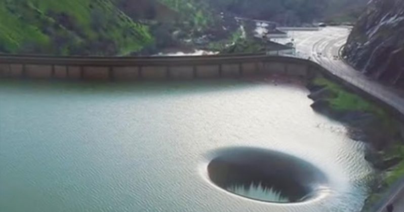 Watch: Giant Hole Sucks In Excess Storm Water In California Lake